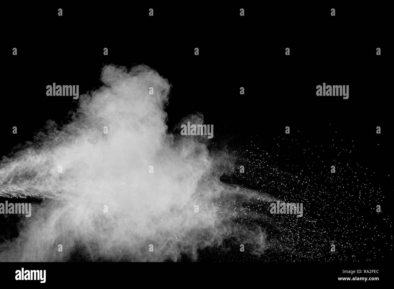 Bizarre forms of white powder explosion cloud against black background ...