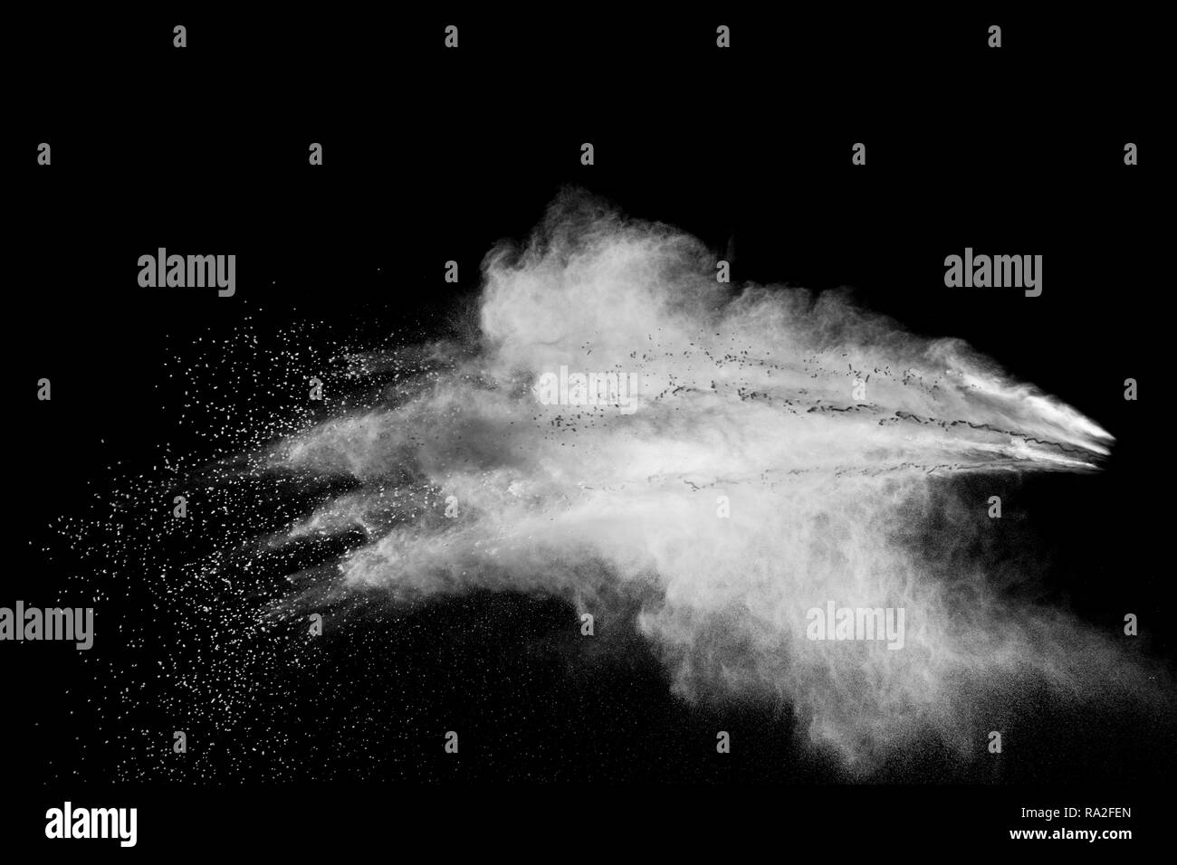 Bizarre forms of white powder explosion cloud against black background ...