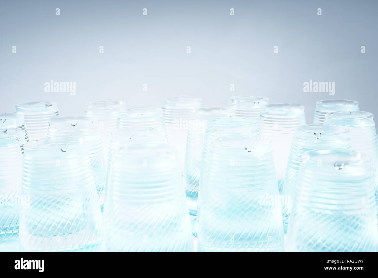 a stack plastic glass of Mineral water on white background Stock Photo ...