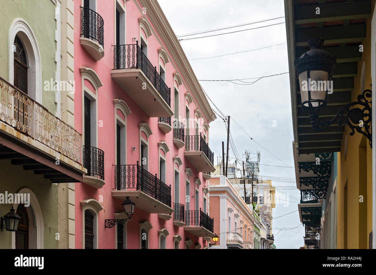 colorful building facades and balconies line streets of old san juan ...