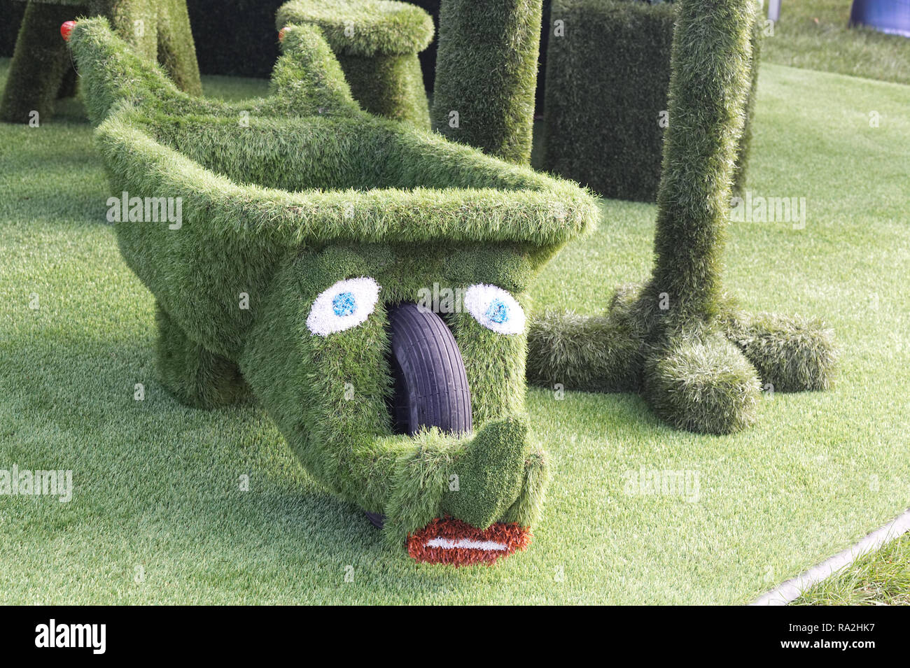 Artificial grass covered wheelbarrow hi-res stock photography and ...