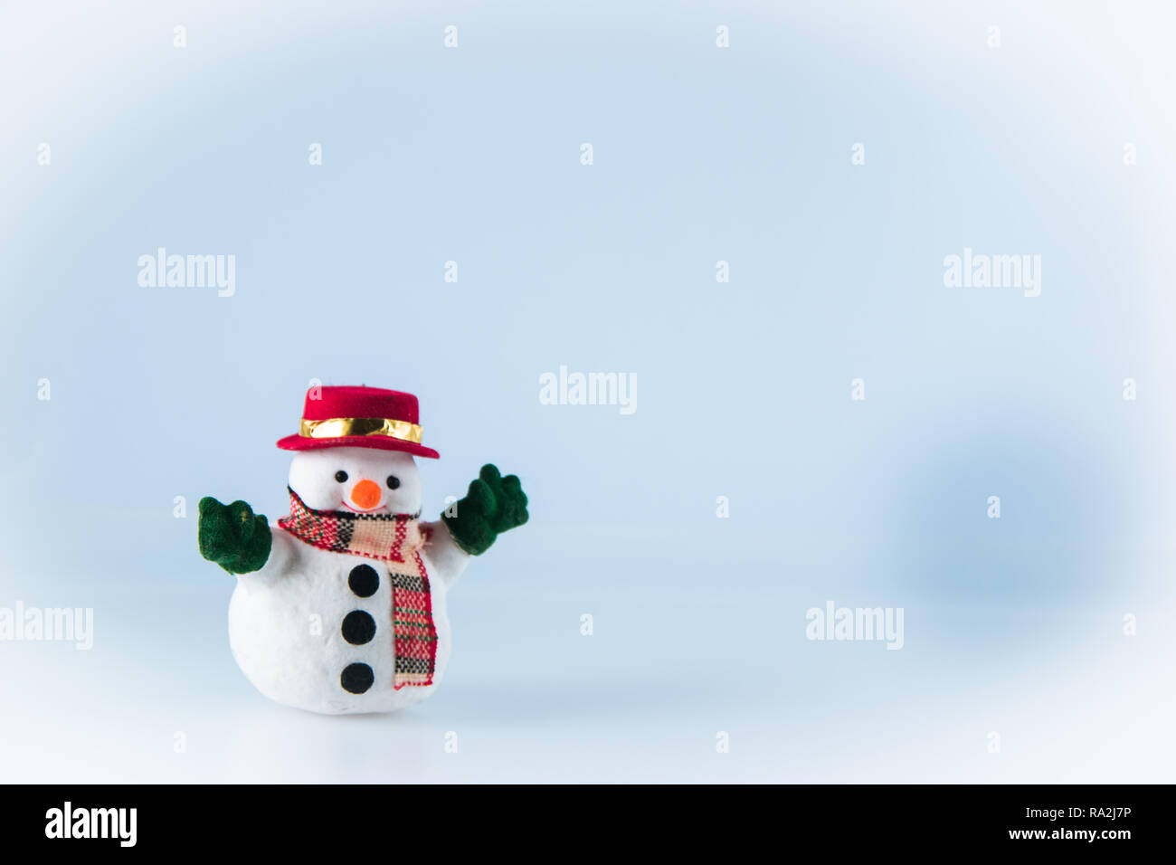 Snowman stand on white background. Snow flake is falling down Stock ...