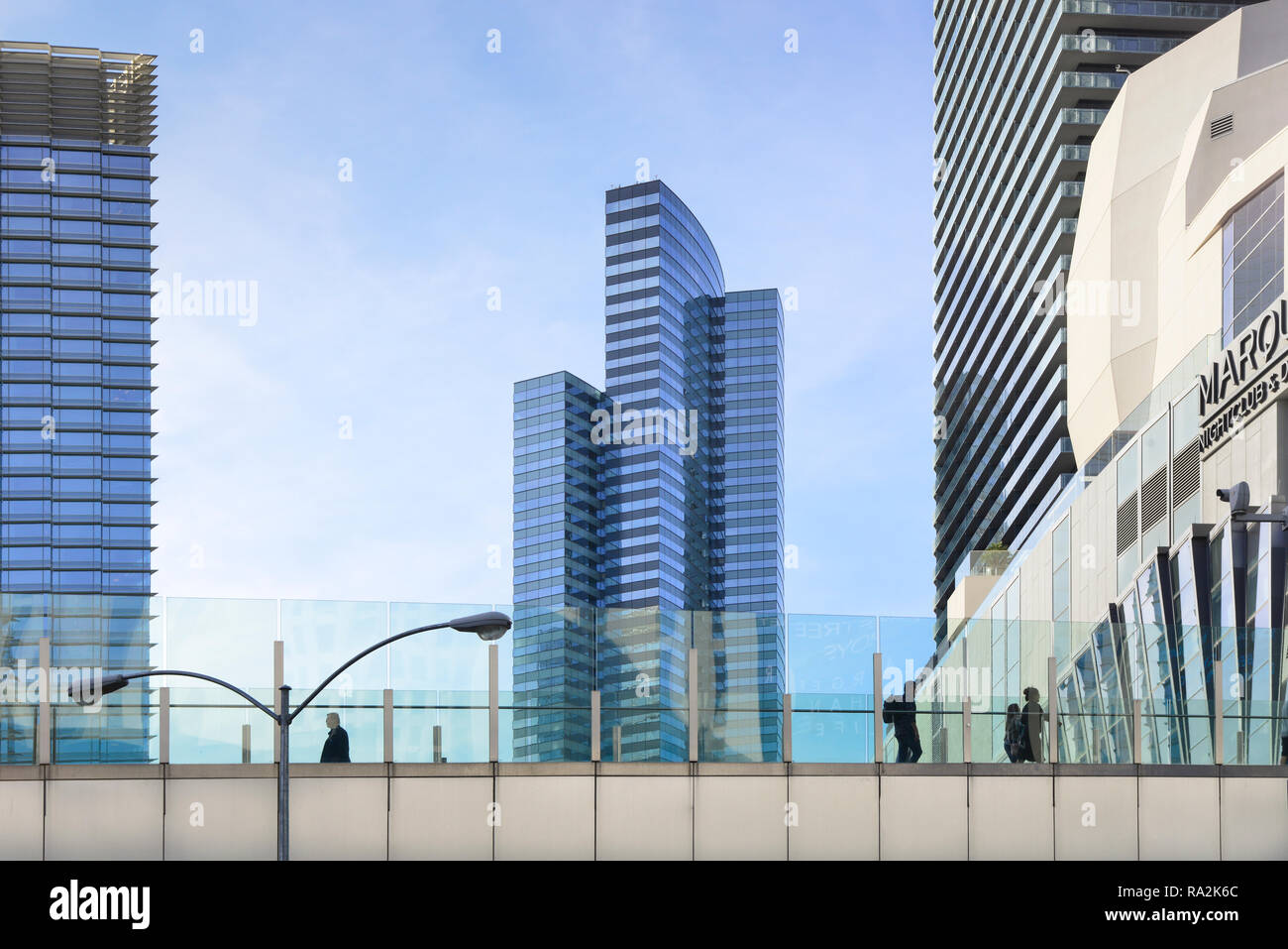 People viewing the Las Vegas Strip area from a pedestrian bridge over ...