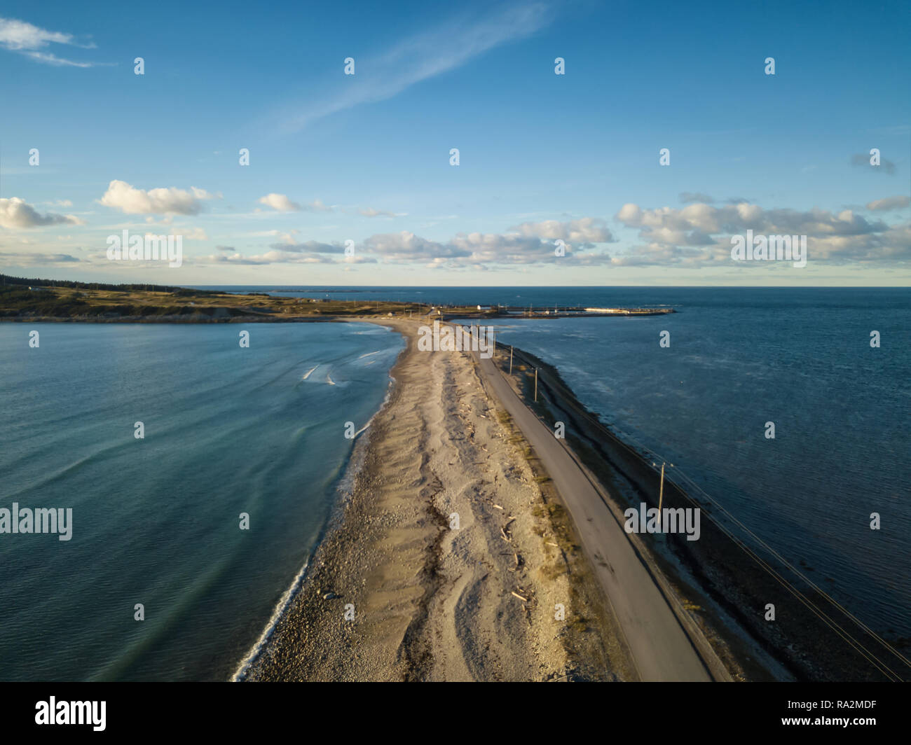 Aerial view of a scenic road during a vibrant sunny day. Taken in Cow ...