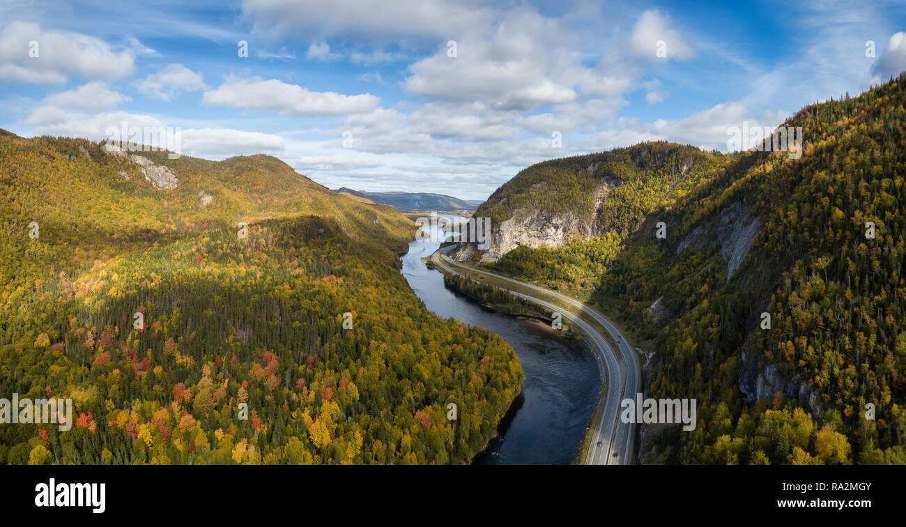 Aerial panoramic view of a scenic road during a vibrant sunny day ...
