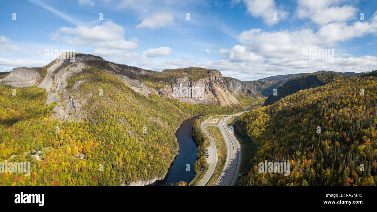 Aerial panoramic view of a scenic road during a vibrant sunny day ...