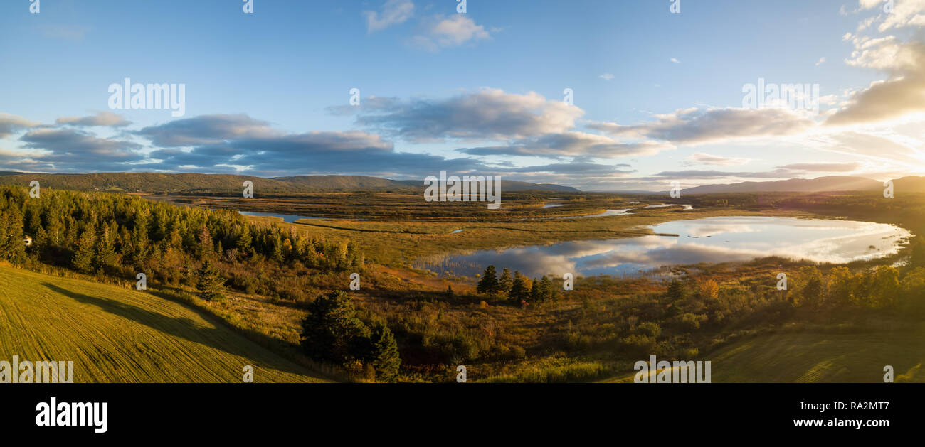 Aerial landscape view of a beautiful river during a sunny sunrise ...