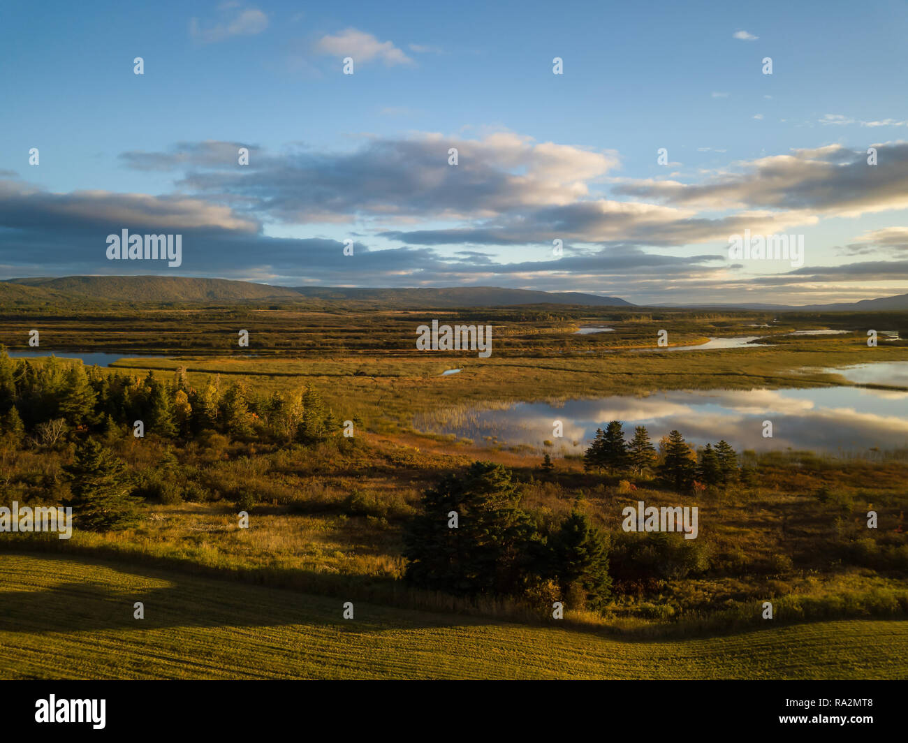 Aerial landscape view of a beautiful river during a sunny sunrise ...