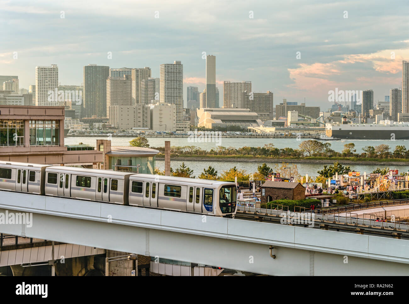 Tokyo Yurikamome Monorail train at Odaiba with the Tokyo Skyline in the ...