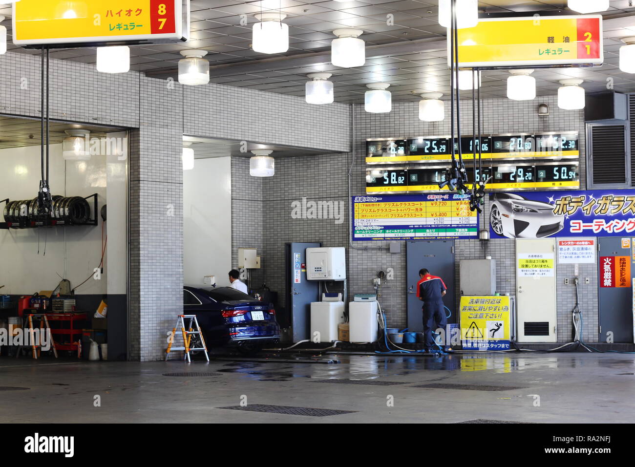 The forecourt of a Shell full-service gas station in Shimbashi in ...