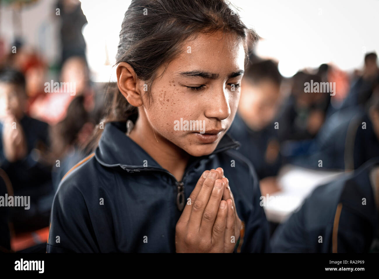Ladakhi young student during a morning prayer that takes place at the ...