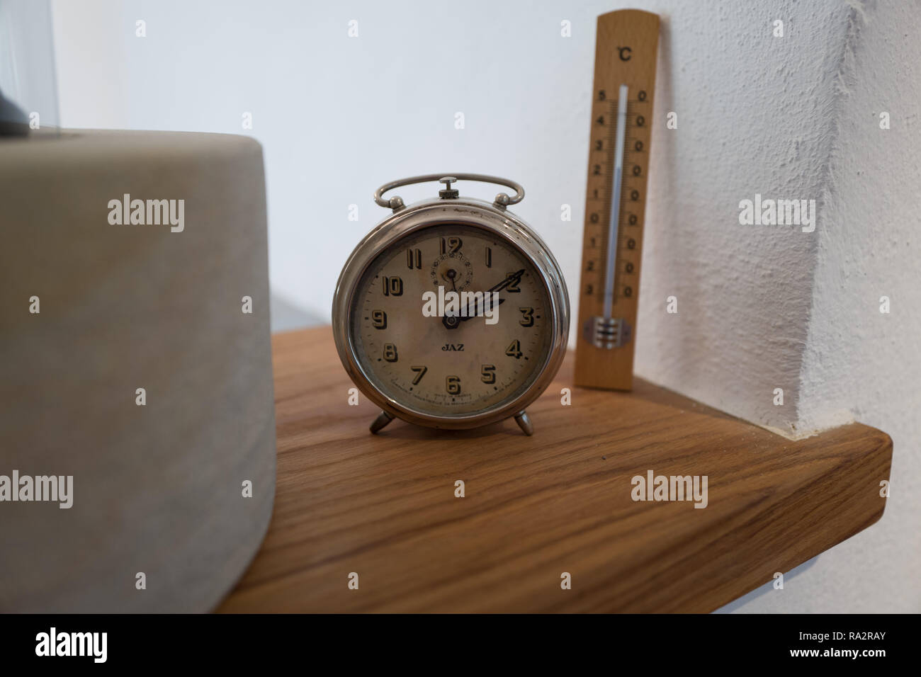 Clock in an old workshop with temperature scale in background Stock ...