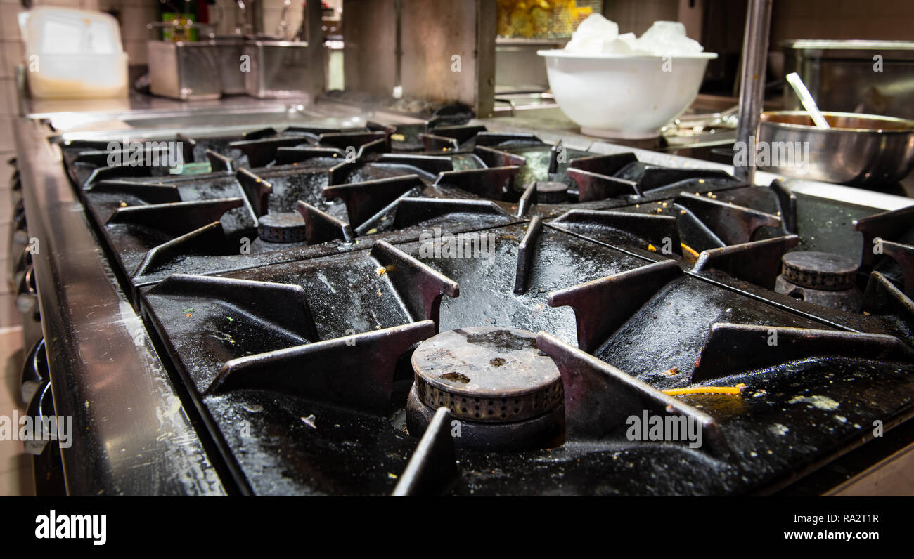 Close up of burn in gas stove top, dirty and greasy after cooking Stock ...