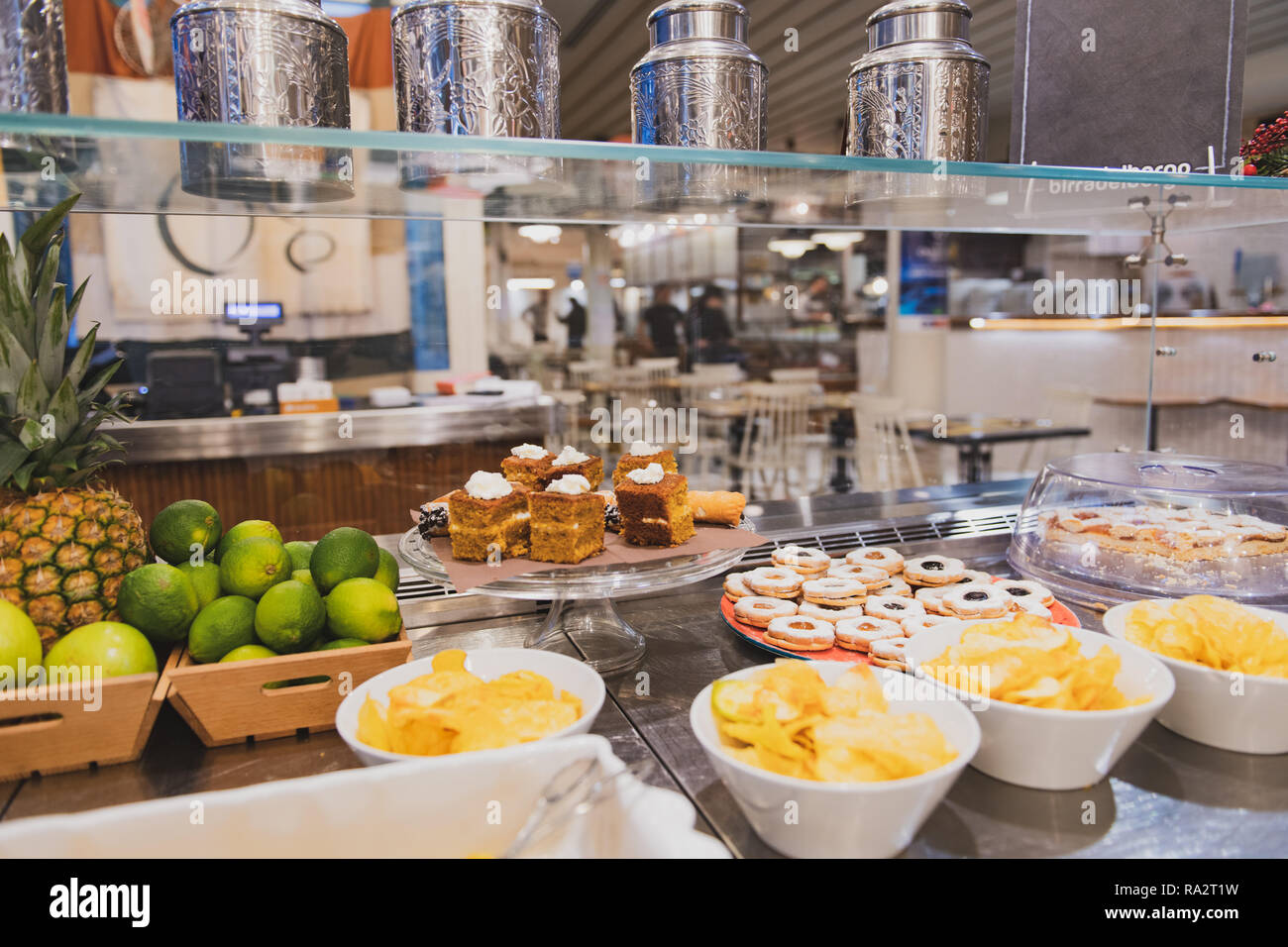 Variation of different food displayed at bar showcase with chips fresh ...