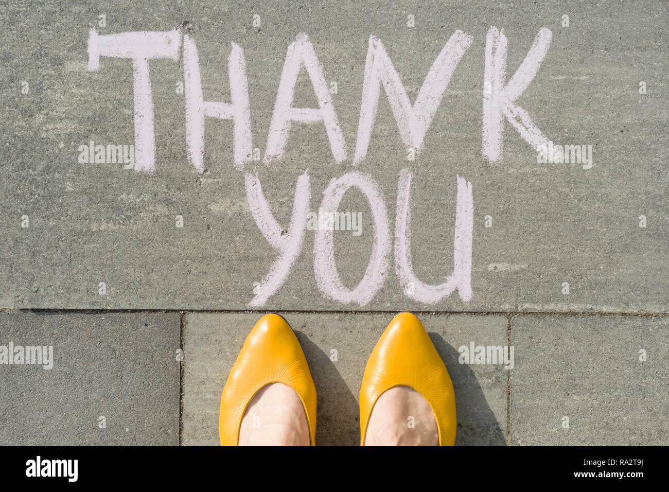 Female feet with text thank you written on grey sidewalk Stock Photo ...