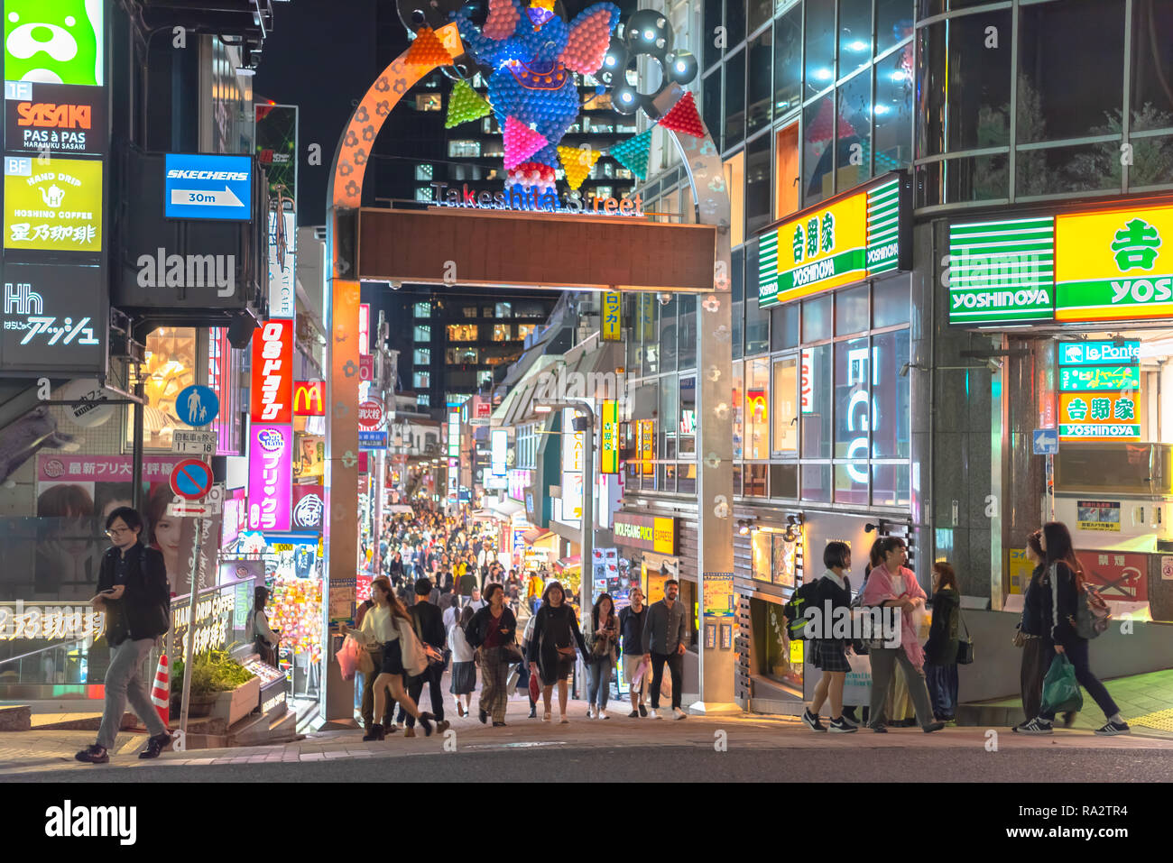 People,mostly youngsters, walk through Takeshita Street, a famous ...