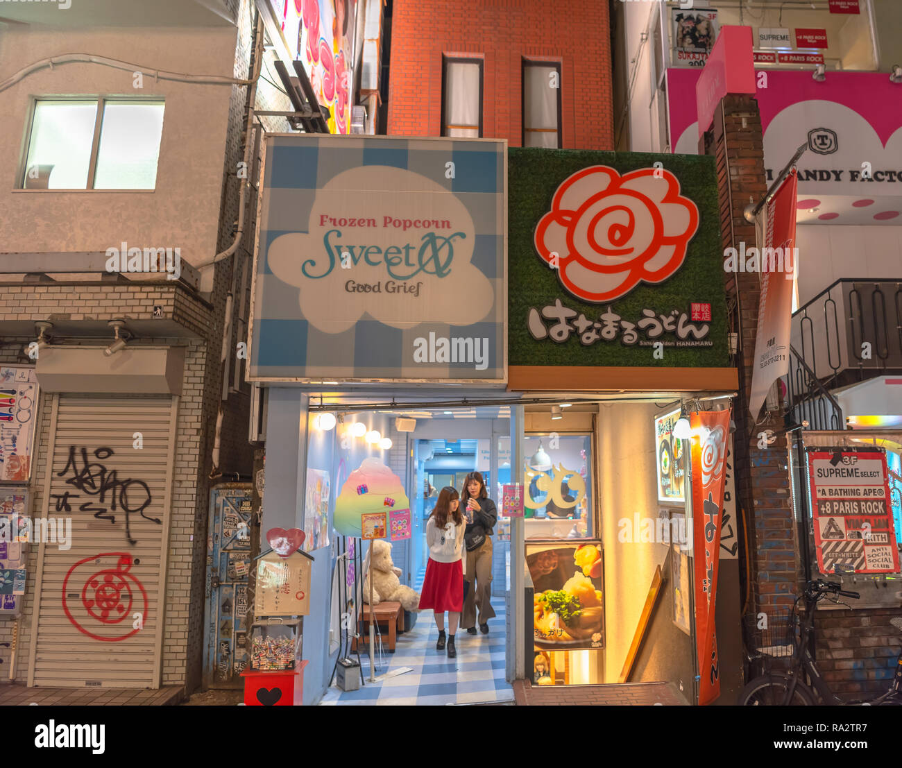 People,mostly youngsters, walk through Takeshita Street, a famous ...