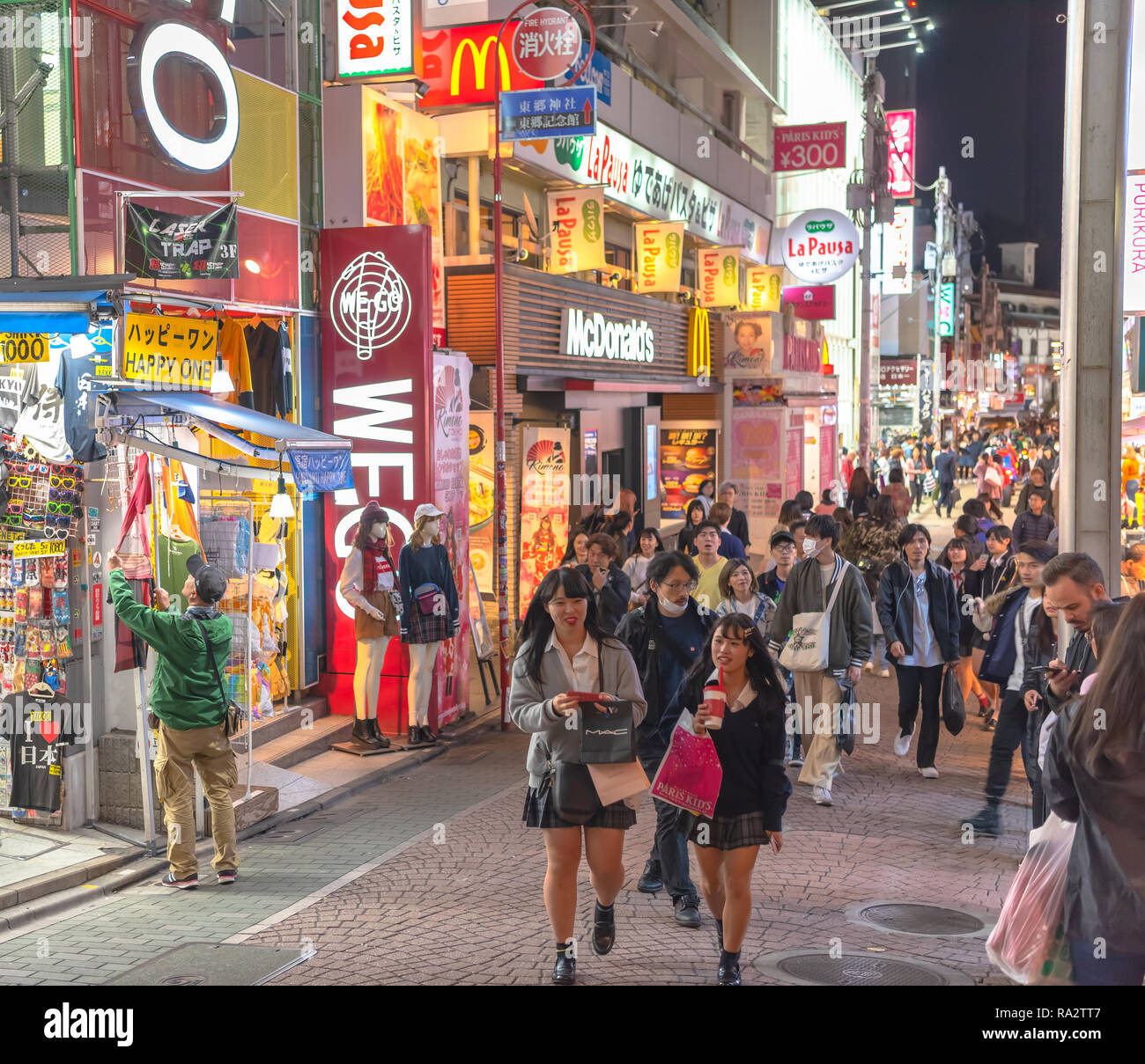 People,mostly youngsters, walk through Takeshita Street, a famous ...