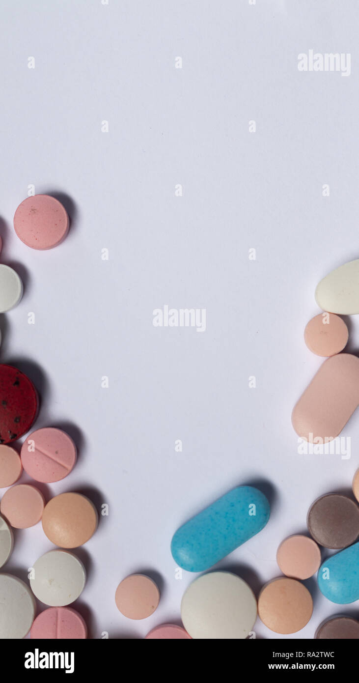 Colorful pills on white background. Legal drugs for human use Stock ...