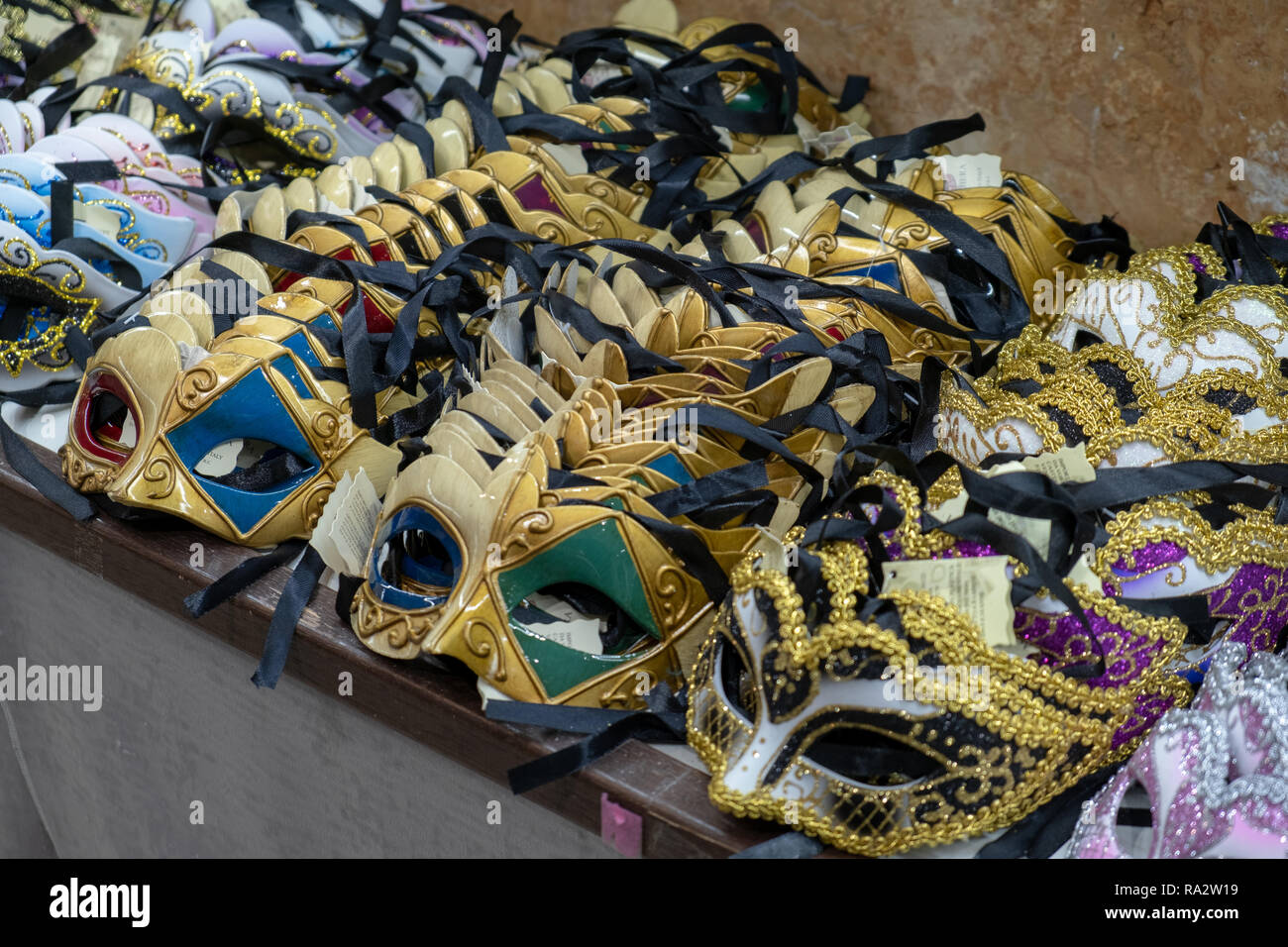 The masks of the Venice carnival hung in a shop. Venetian masks ...