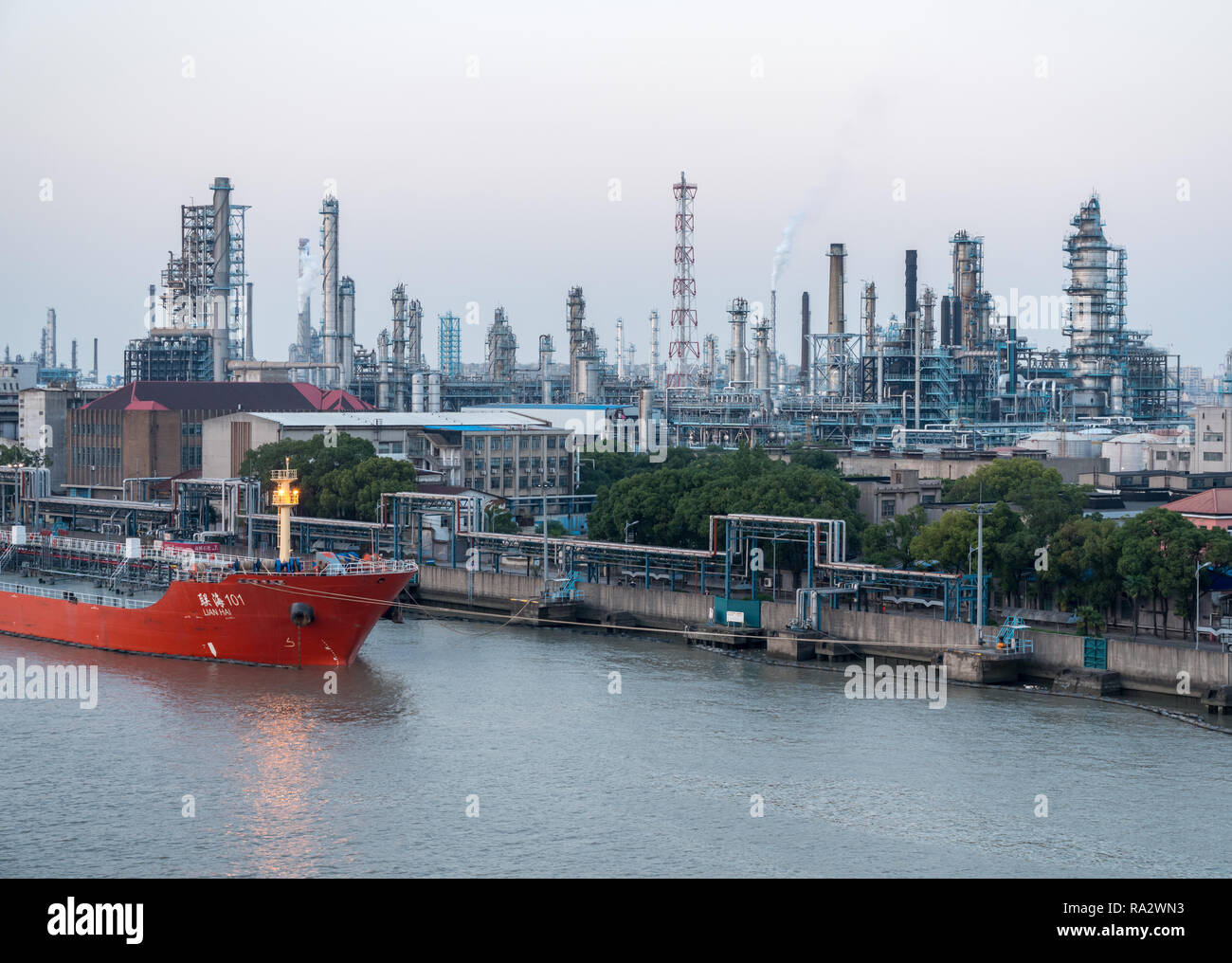 Oil refinery on river in Shanghai Stock Photo - Alamy
