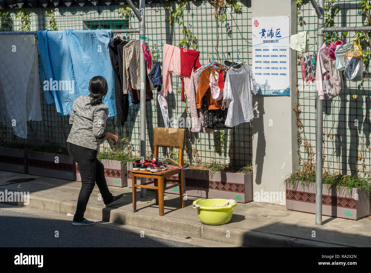 Woman hanging out washing on hi-res stock photography and images - Alamy