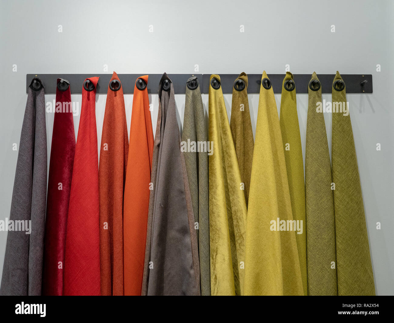 Rack with multiple colors and materials of sample fabrics Stock Photo ...