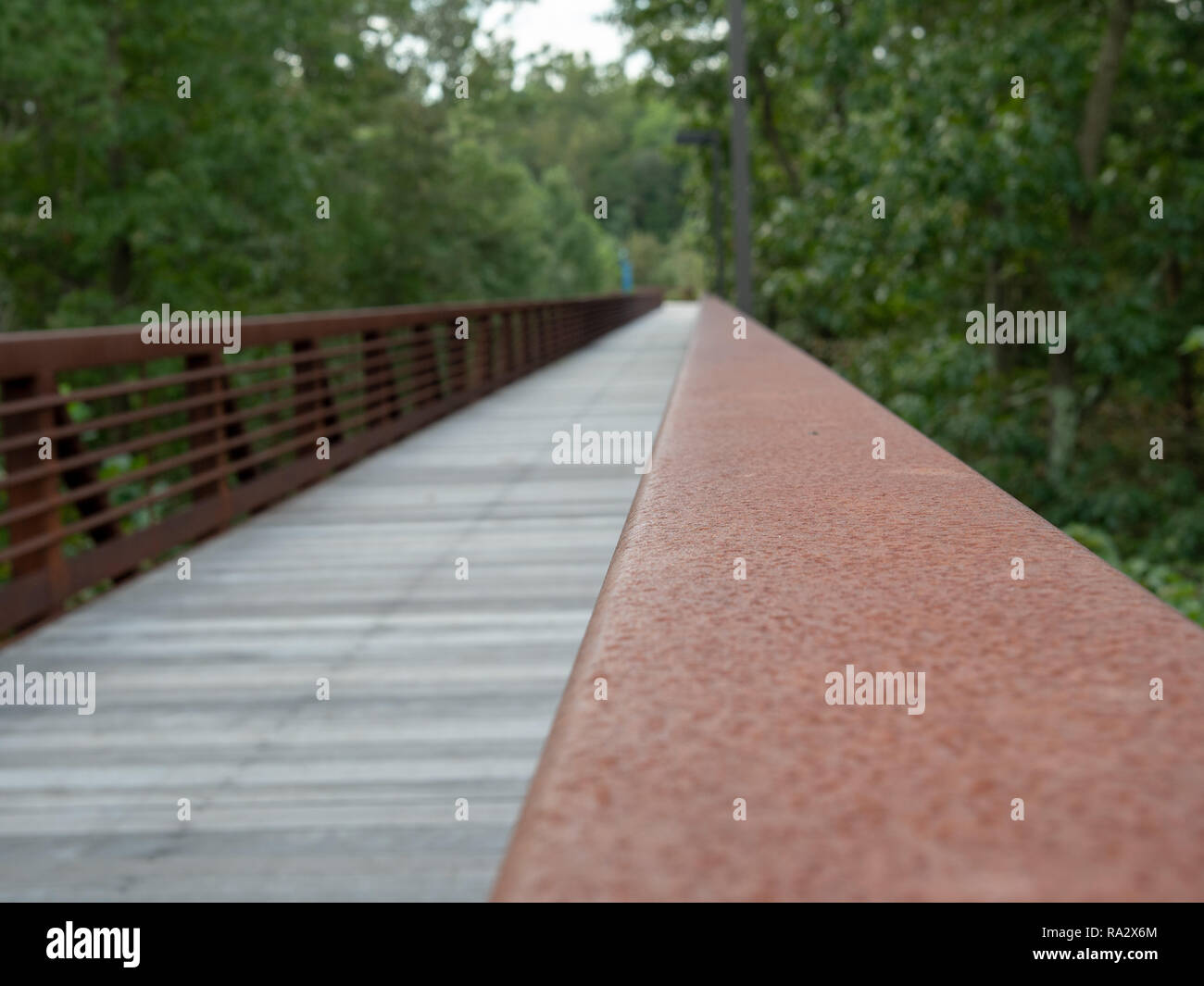 Close view of rusted hand rail along a wooden foot bridge Stock Photo ...