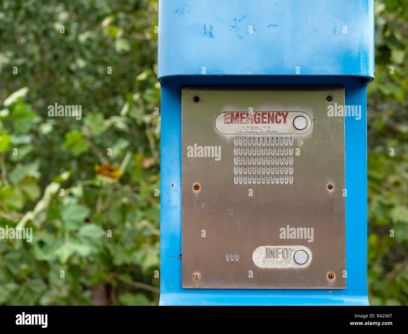 Emergency button, info button and speaker on a blue emergency post ...