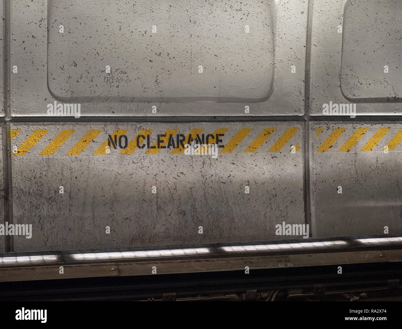 No clearance sign painted on a concrete wall in subway station Stock ...