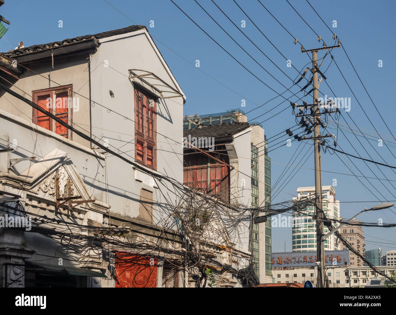 Electric and telephone cabling on poles in Shanghai China Stock Photo ...