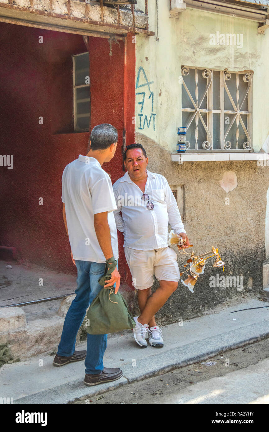 two hispanic men talking in street in Havana, Cuba, Caribbean Stock ...