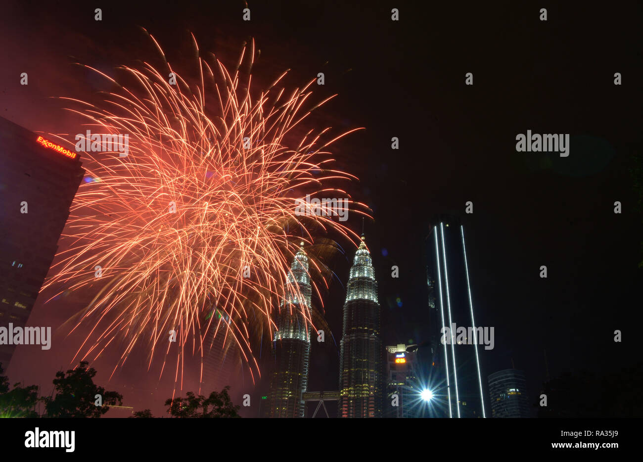 Kuala Lumpur, Malaysia. 1st Jan, 2019. Fireworks explode near Malaysia ...