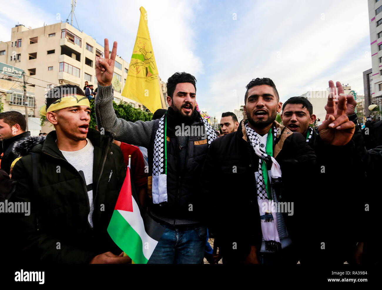 Palestinians seen flashing victory signs during the protest ...