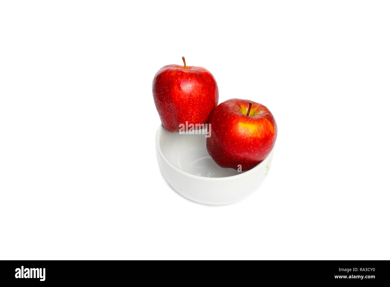 apple red two in bowl and water drip on white background Stock Photo ...