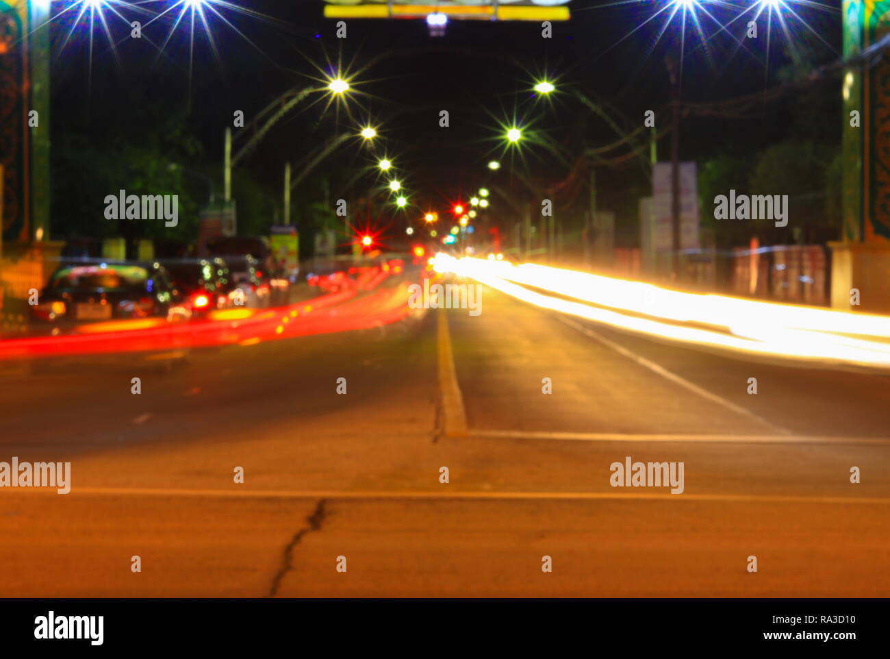 Car light moving blurred on way road at night in the city Stock Photo ...