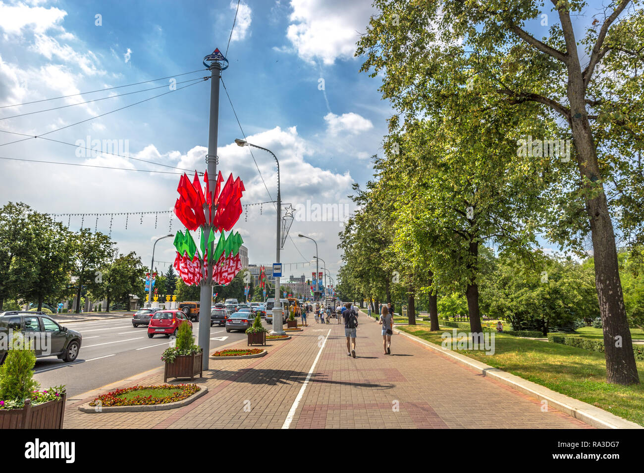 Minsk, Belarus, June 28th 2018 - Tourists and locals walking in a wide ...