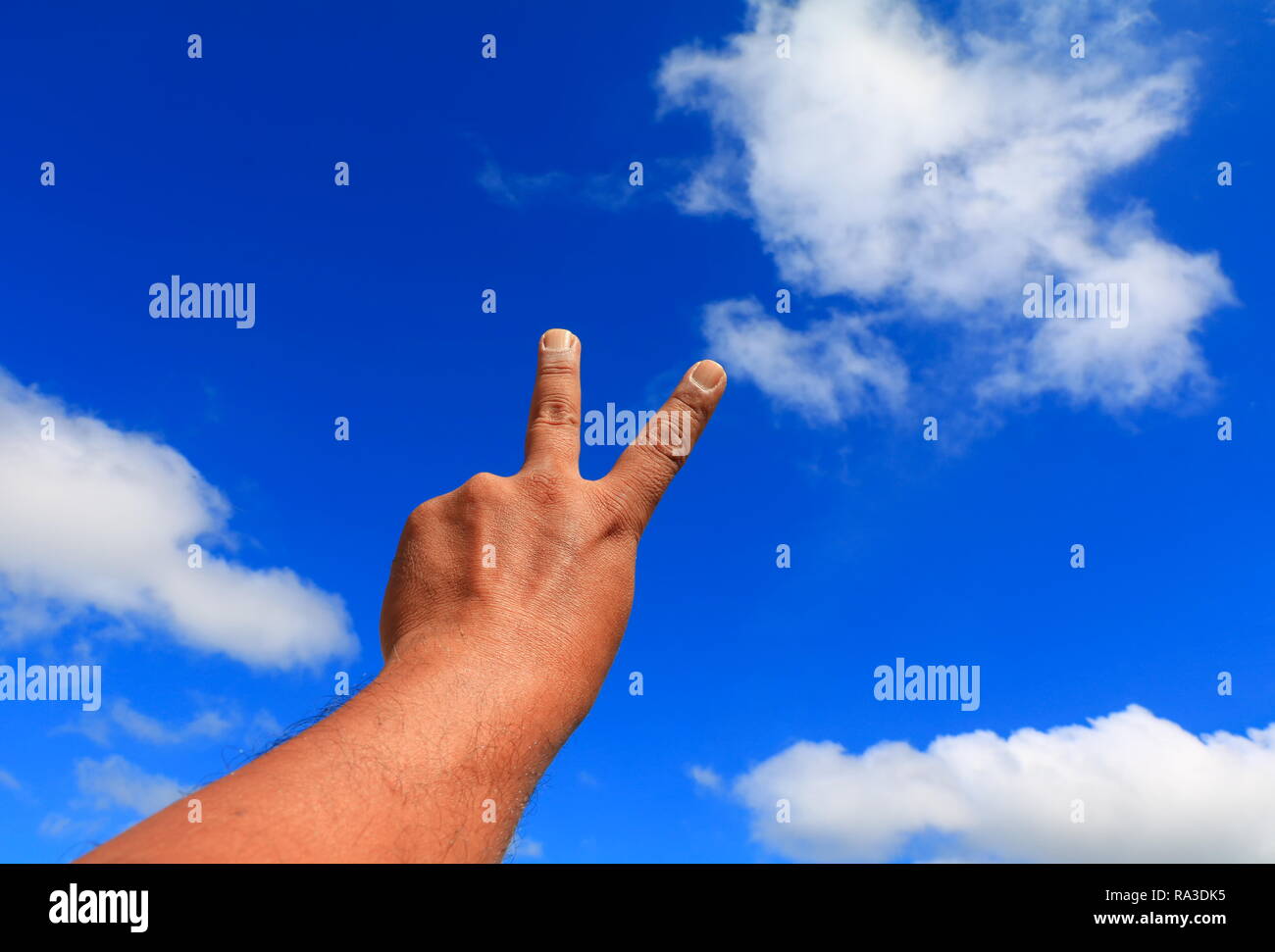 hand two fingers. on sky background Stock Photo - Alamy