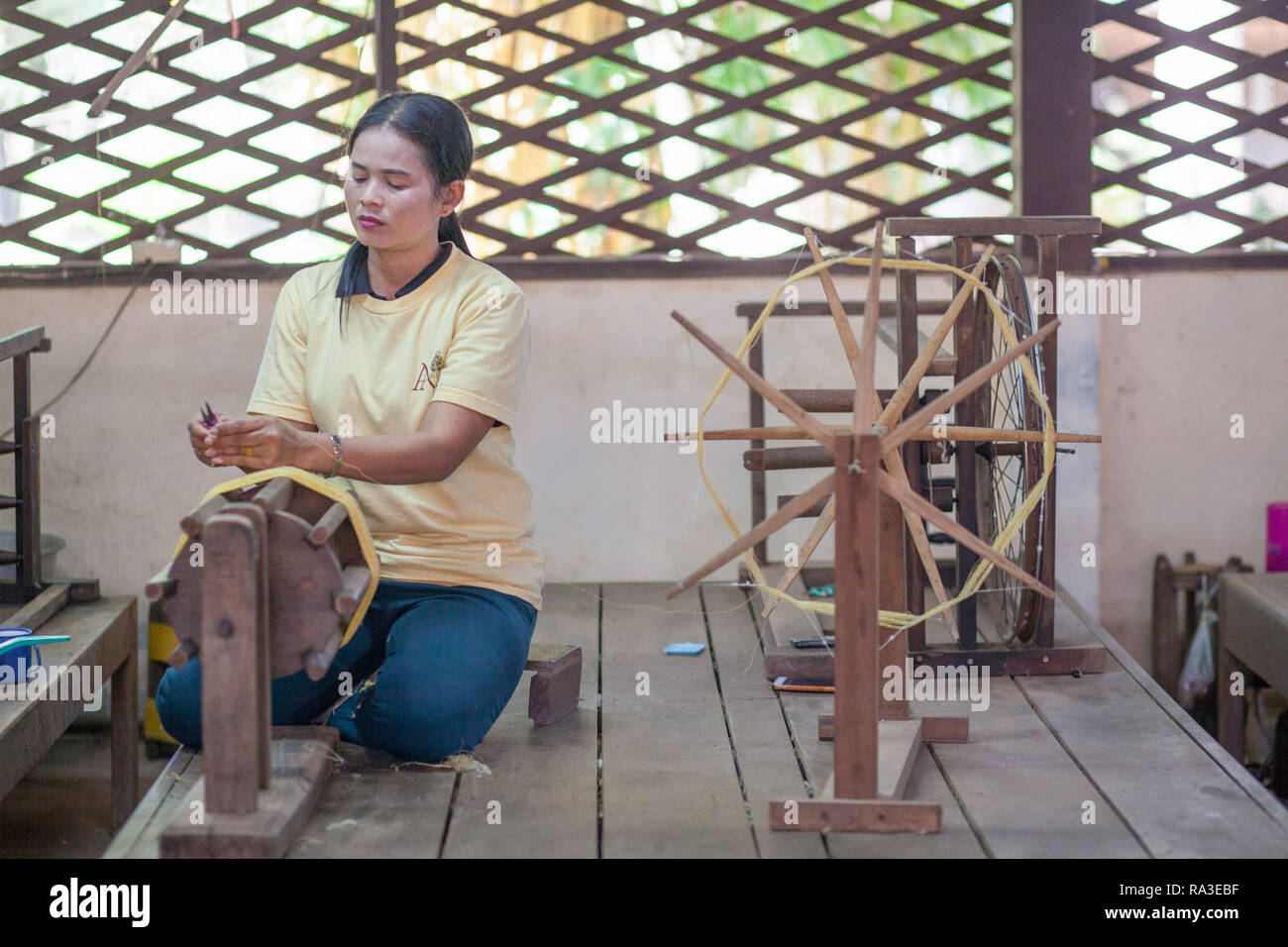 Ladies are working at silk clothes production at siam reap cambodia ...