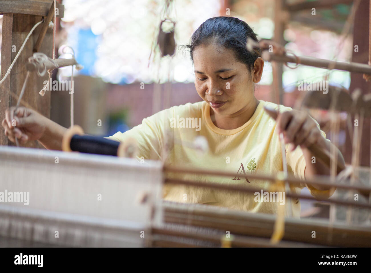 Ladies are working at silk clothes production at siam reap cambodia ...