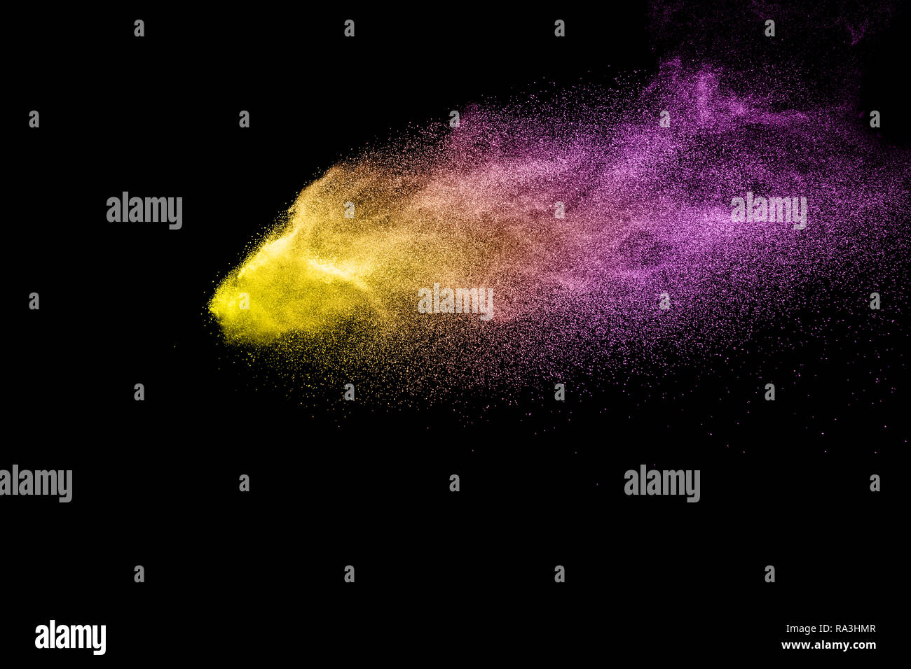 Multi color particles explosion on black background. Colorful dust ...