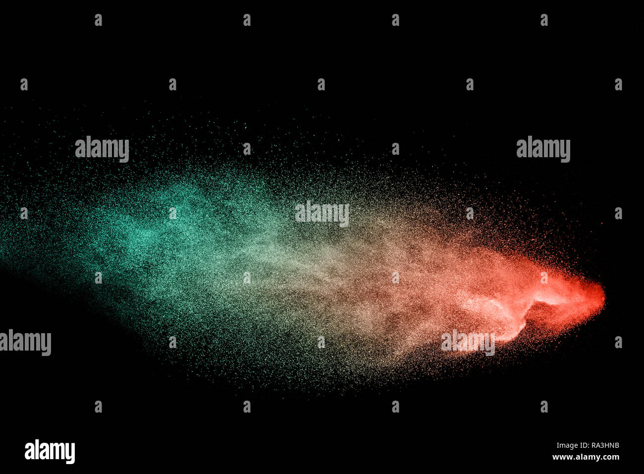 Multi color particles explosion on black background. Colorful dust ...