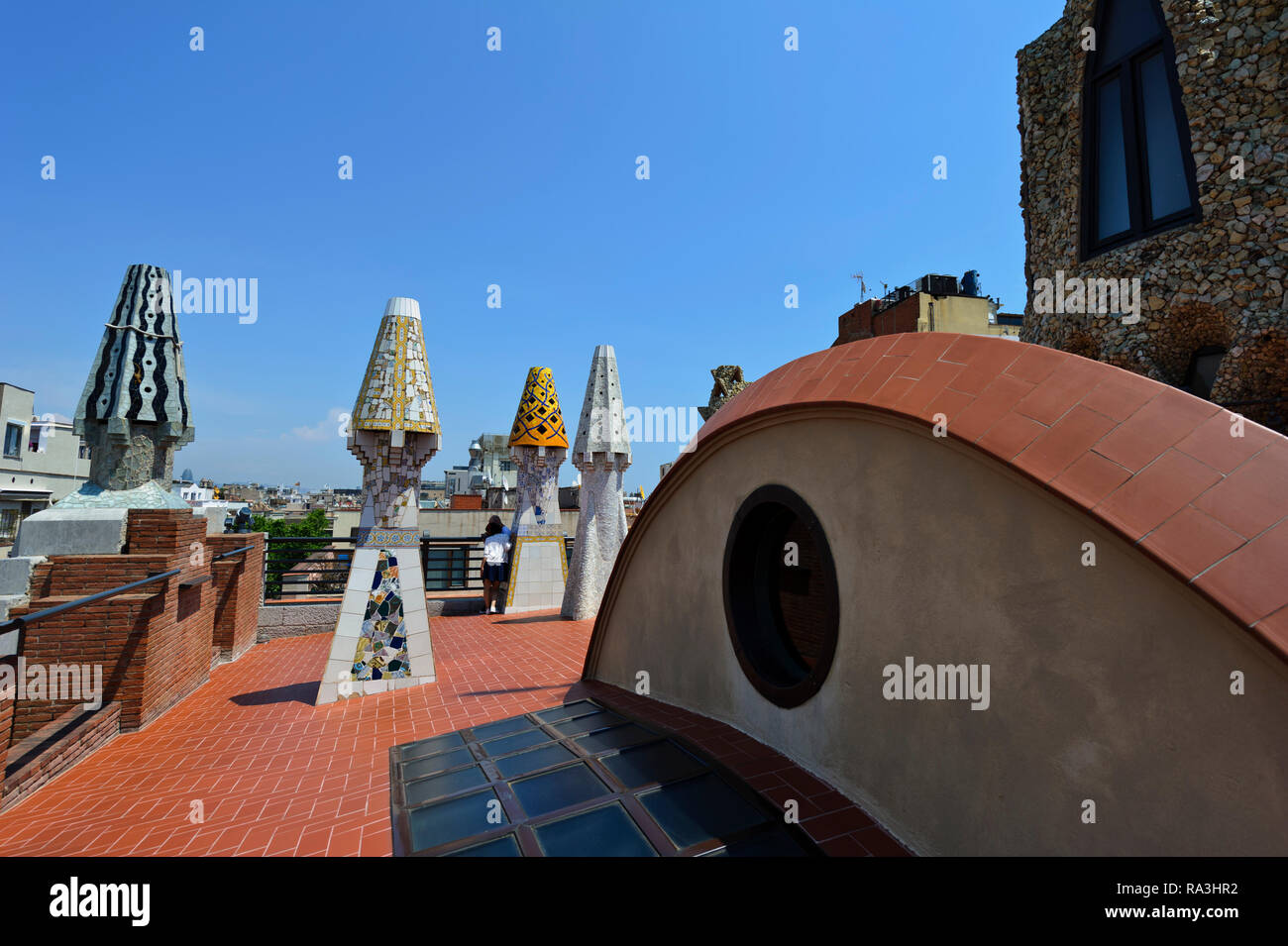 Colourful obelisks on the rooftop of the Guell Palace designed by ...