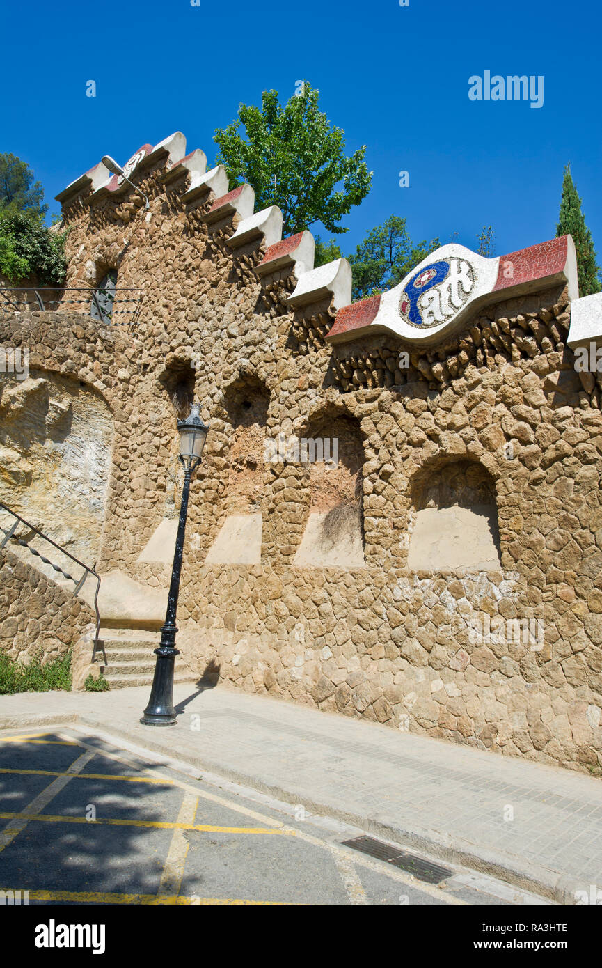 Stoney wall around the perimeter of the Park Guell designed by Antoni ...
