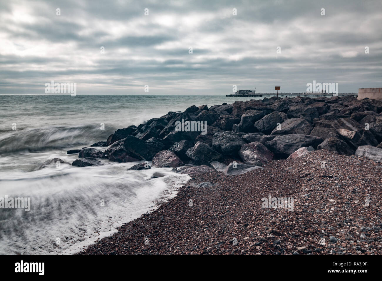 Worthing beach captured using a slow shutter speed so that the sea ...