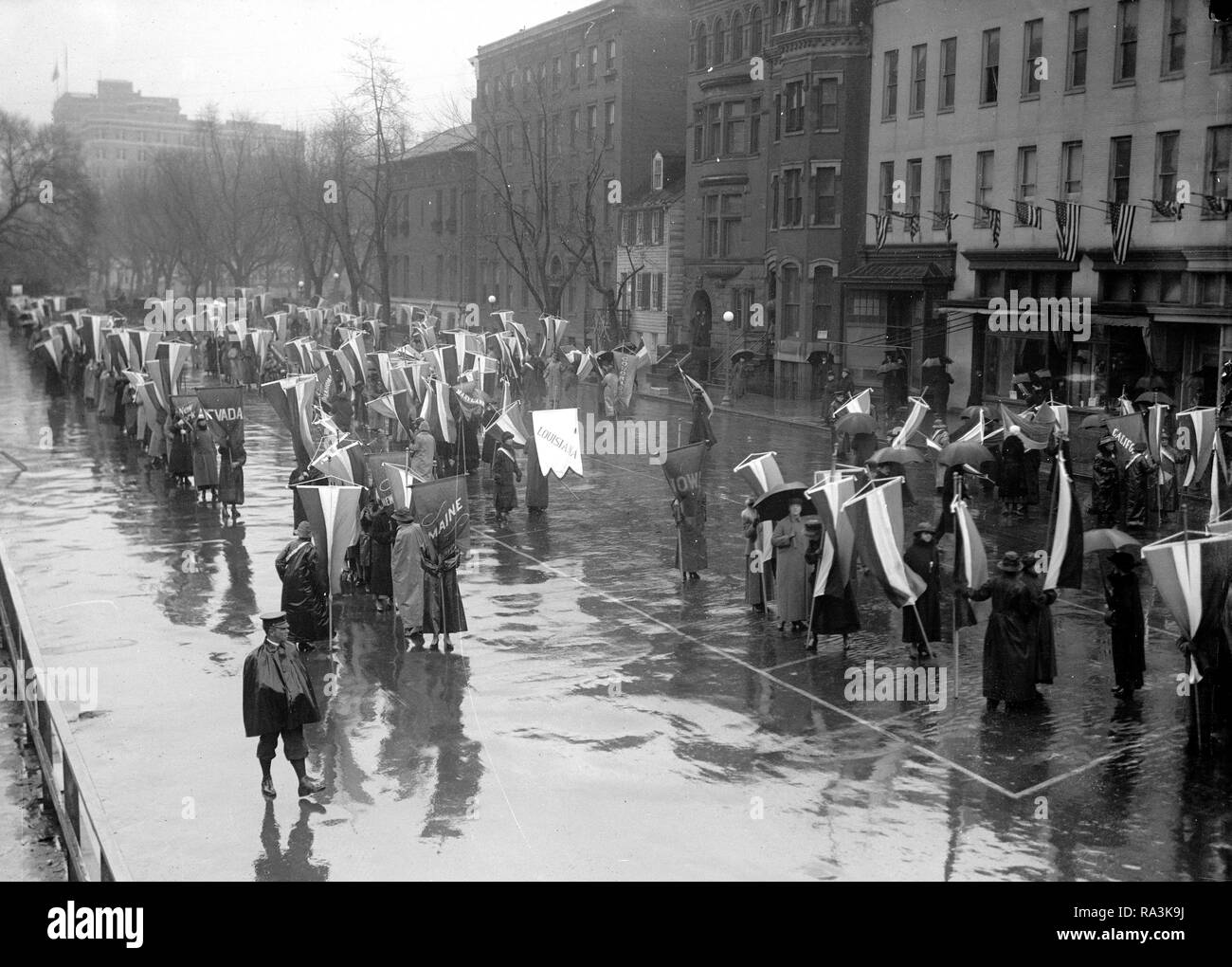 Woman suffragettes marching in the rain ca. 1917 Stock Photo - Alamy