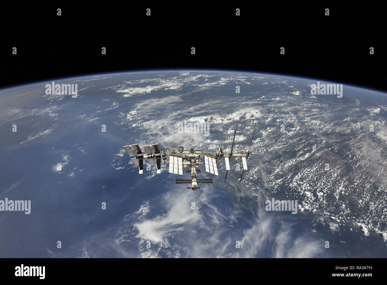The International Space Station orbits over the earth December 20, 2018 ...