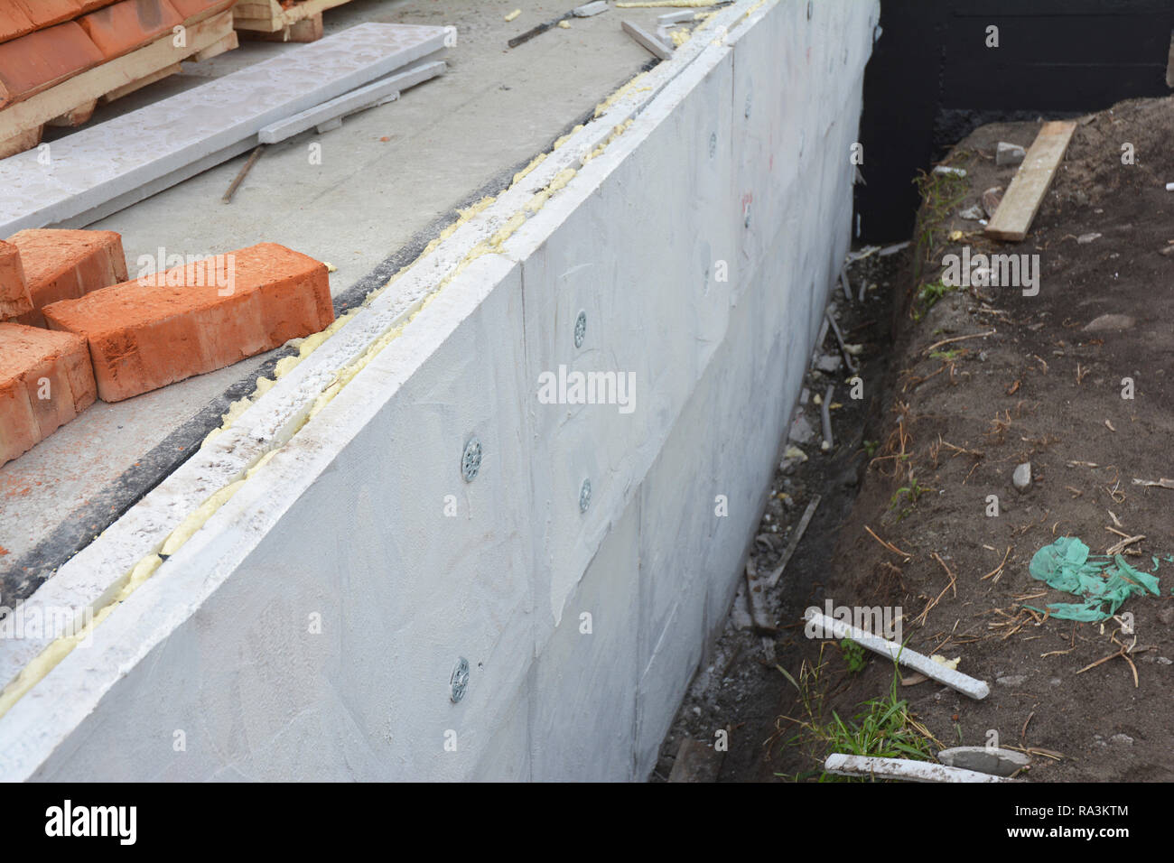 Foundation insulation. House wall foundation insulation with ...