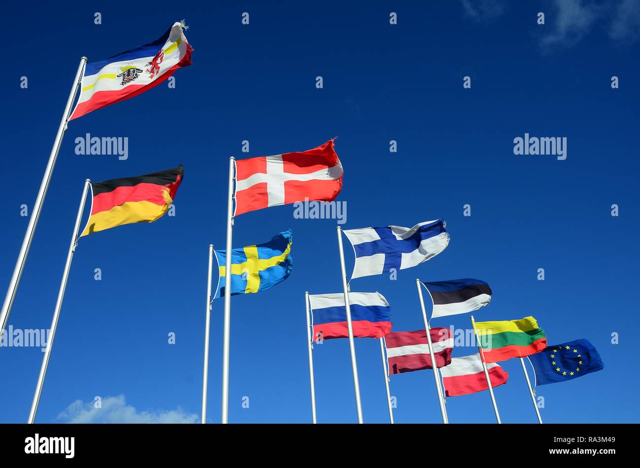 Various international flags against a blue sky, Mecklenburg-Western ...