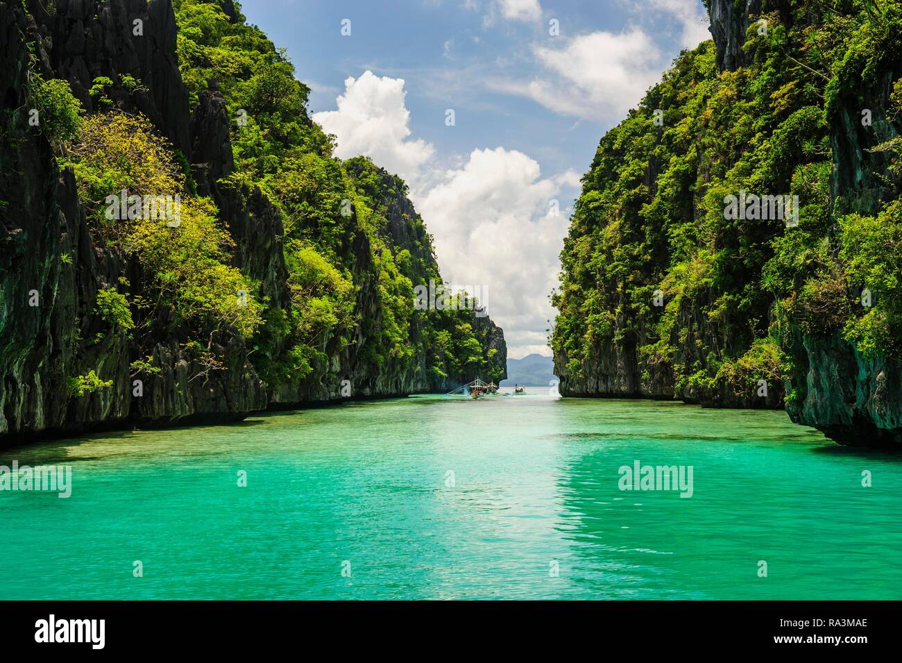 Crystal clear water between limestones in the Bacuit archipelago ...